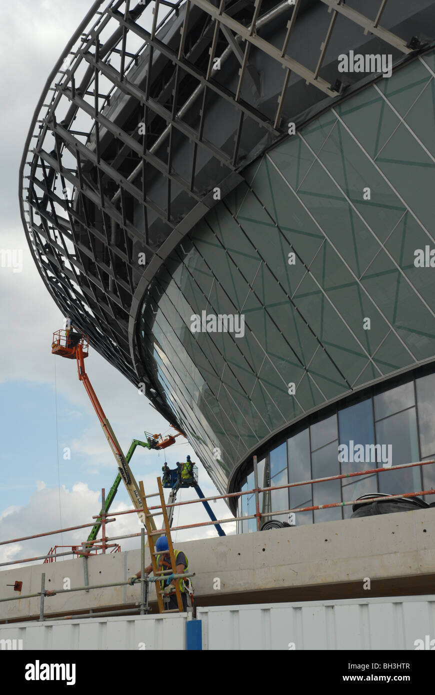 Construction of a modern arena type stadium with a cantilever roof ...