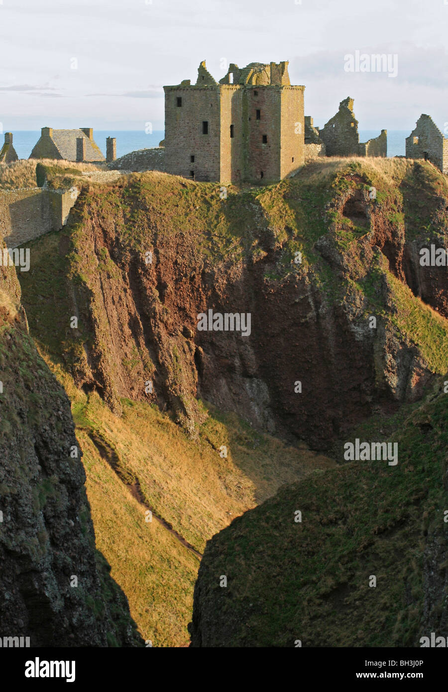 Ancient Dunnottar castle on the cliffs along the North East coast ...