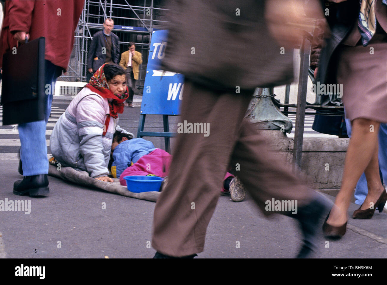 HOMELESS ROMS GYPSY WOMAN AND HER CHILD AT THE EXIT OF A PARISIAN ...