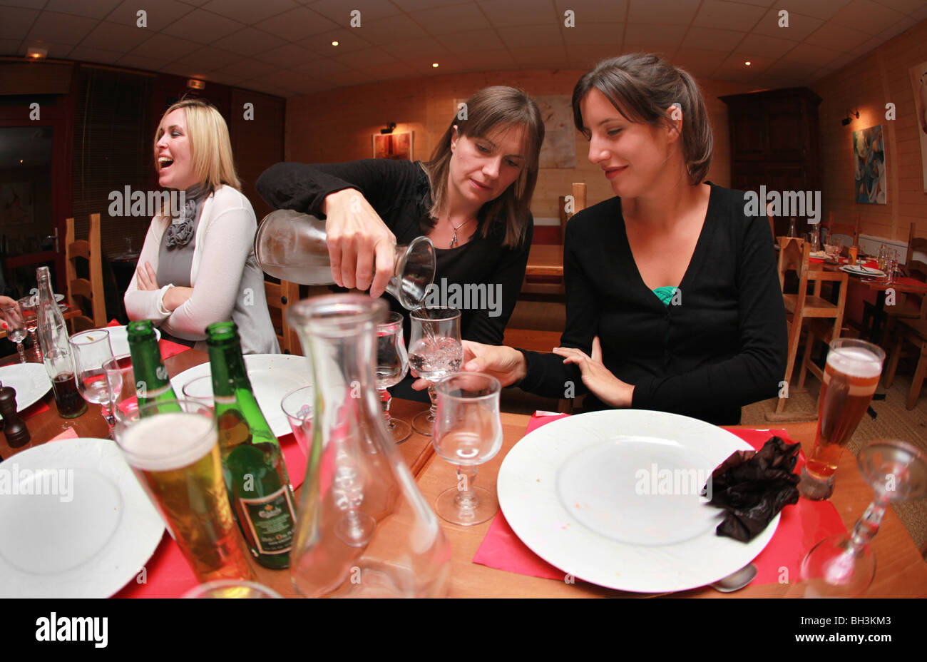 Friends wining and dining together Stock Photo - Alamy