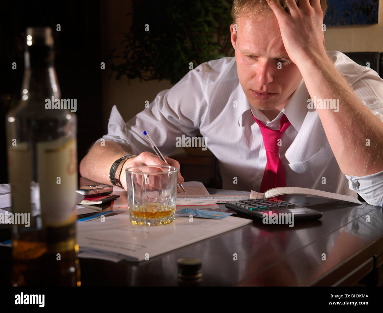 Young family man struggling to pay bills during the economic financial ...