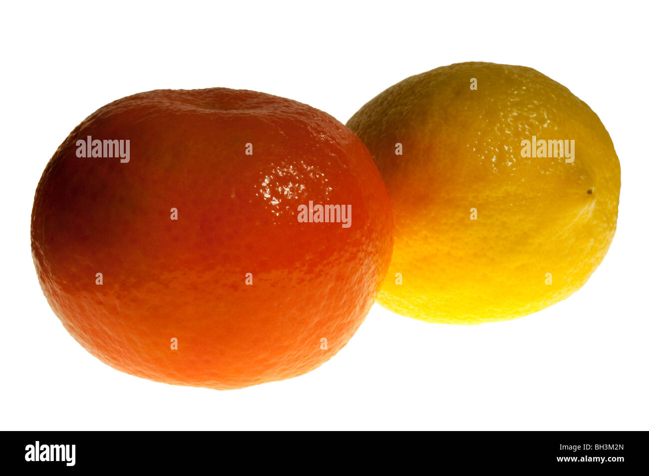 Mandarin and lemon isolated on white Stock Photo - Alamy