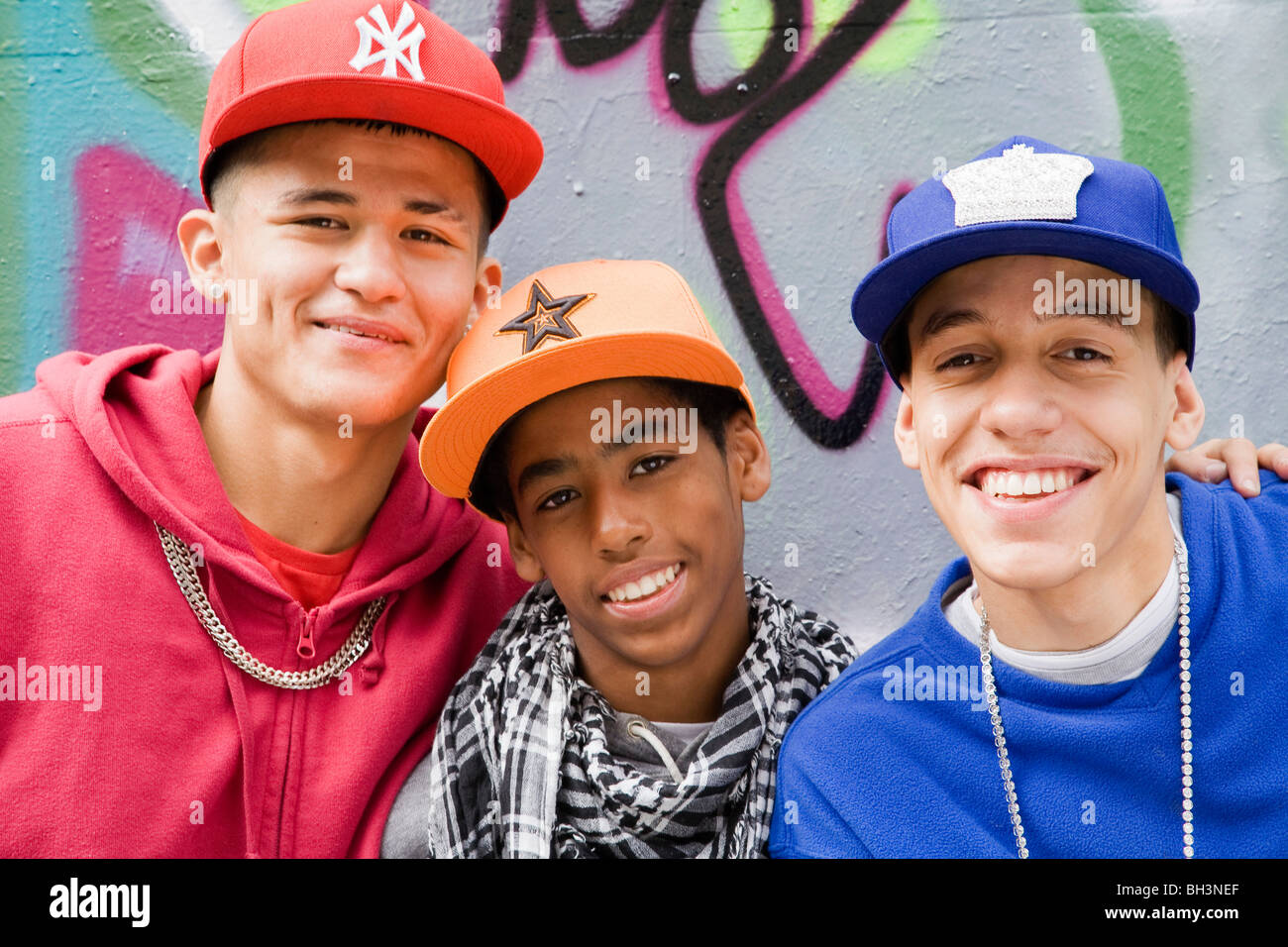 Teenage gang against graffiti wall Stock Photo - Alamy
