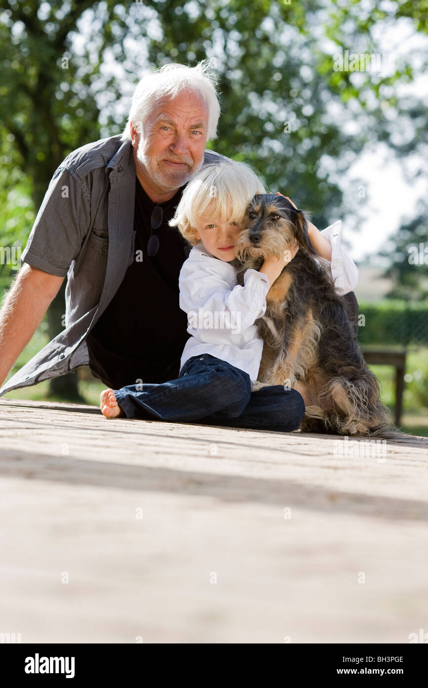 grandfather and grandson with dog Stock Photo - Alamy