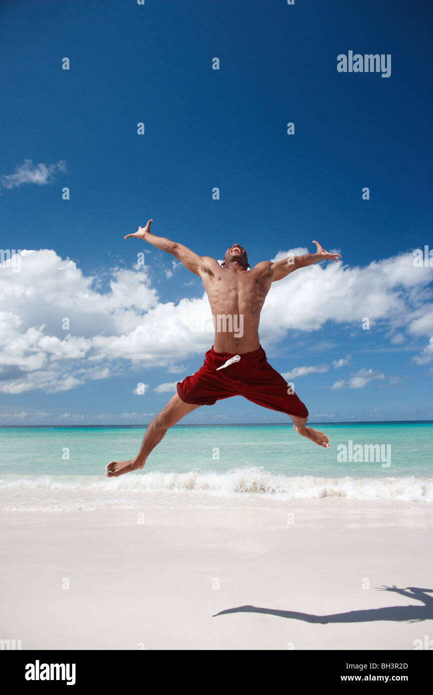 Young man leaping hi-res stock photography and images - Alamy