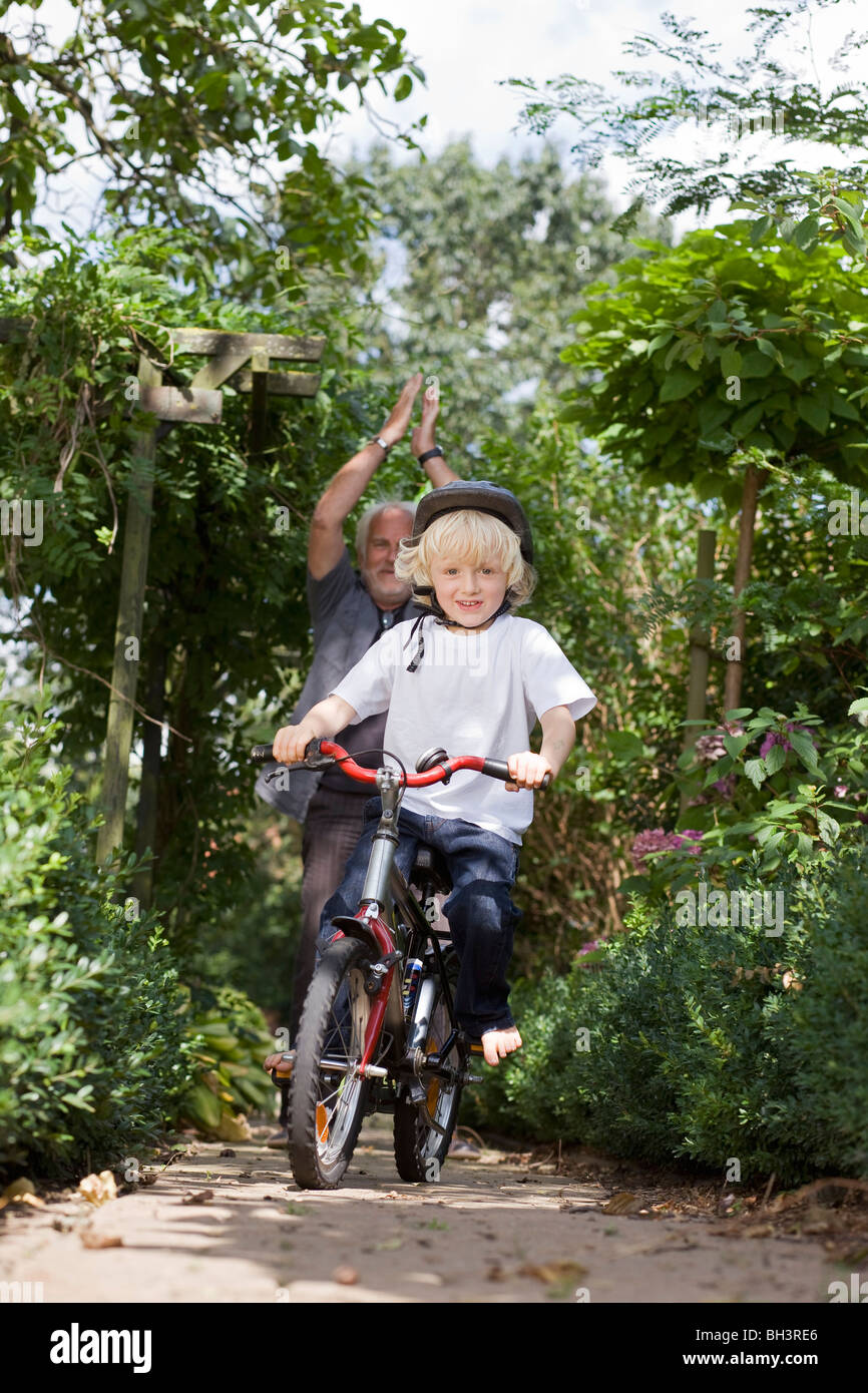 Barefoot man bicycle hi-res stock photography and images - Alamy