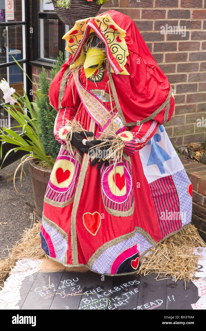 A crow scarecrow in red costume at Flamstead Scarecrow Festival Stock ...