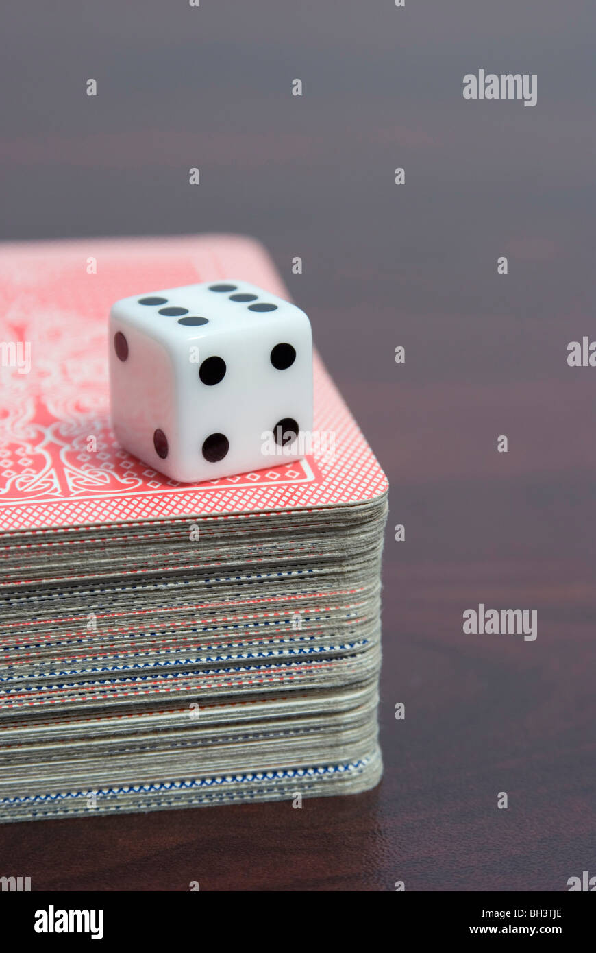 dice on playing cards pack Stock Photo - Alamy