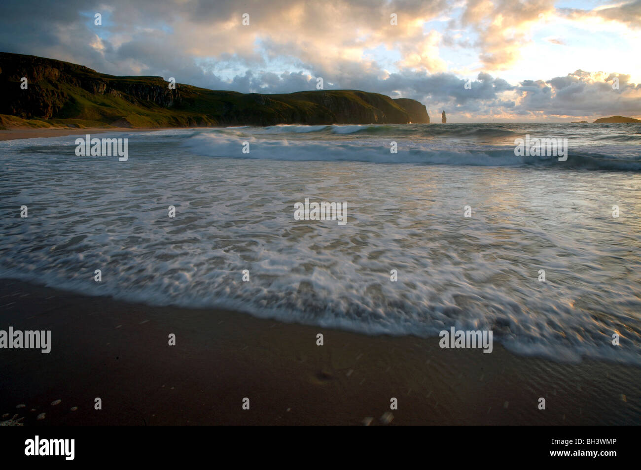 Foaming surf and Am Buachaille sea stack at Sandwood Bay Stock Photo ...