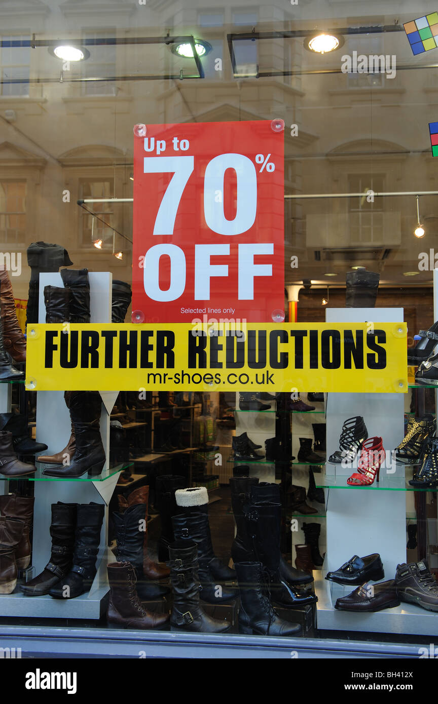 sale poster in a shop window Sale clearance cut-price recession ...