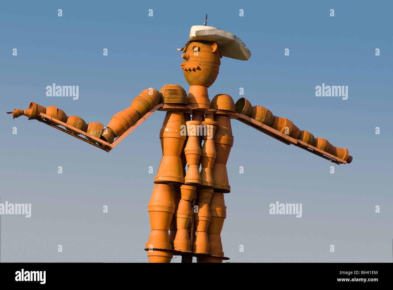 Figure of man made of flower pots on display at garden store in ...