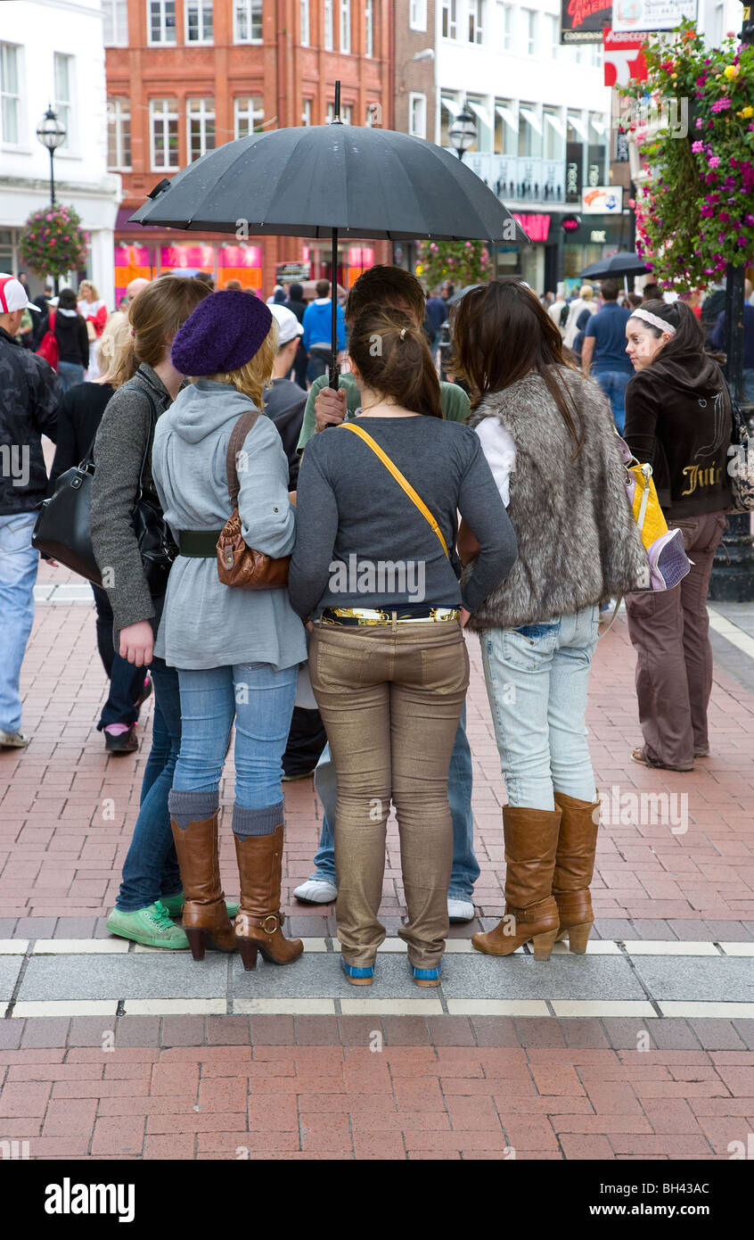 crowd under umbrella Stock Photo - Alamy