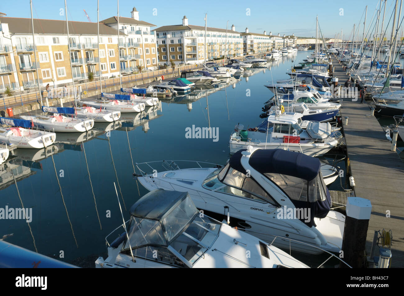 Fishing boats and yachts tied up in Brighton Marina on the south coast ...