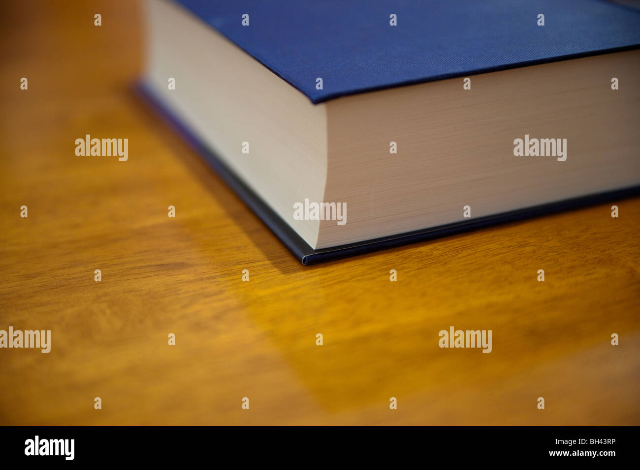 book on table Stock Photo - Alamy