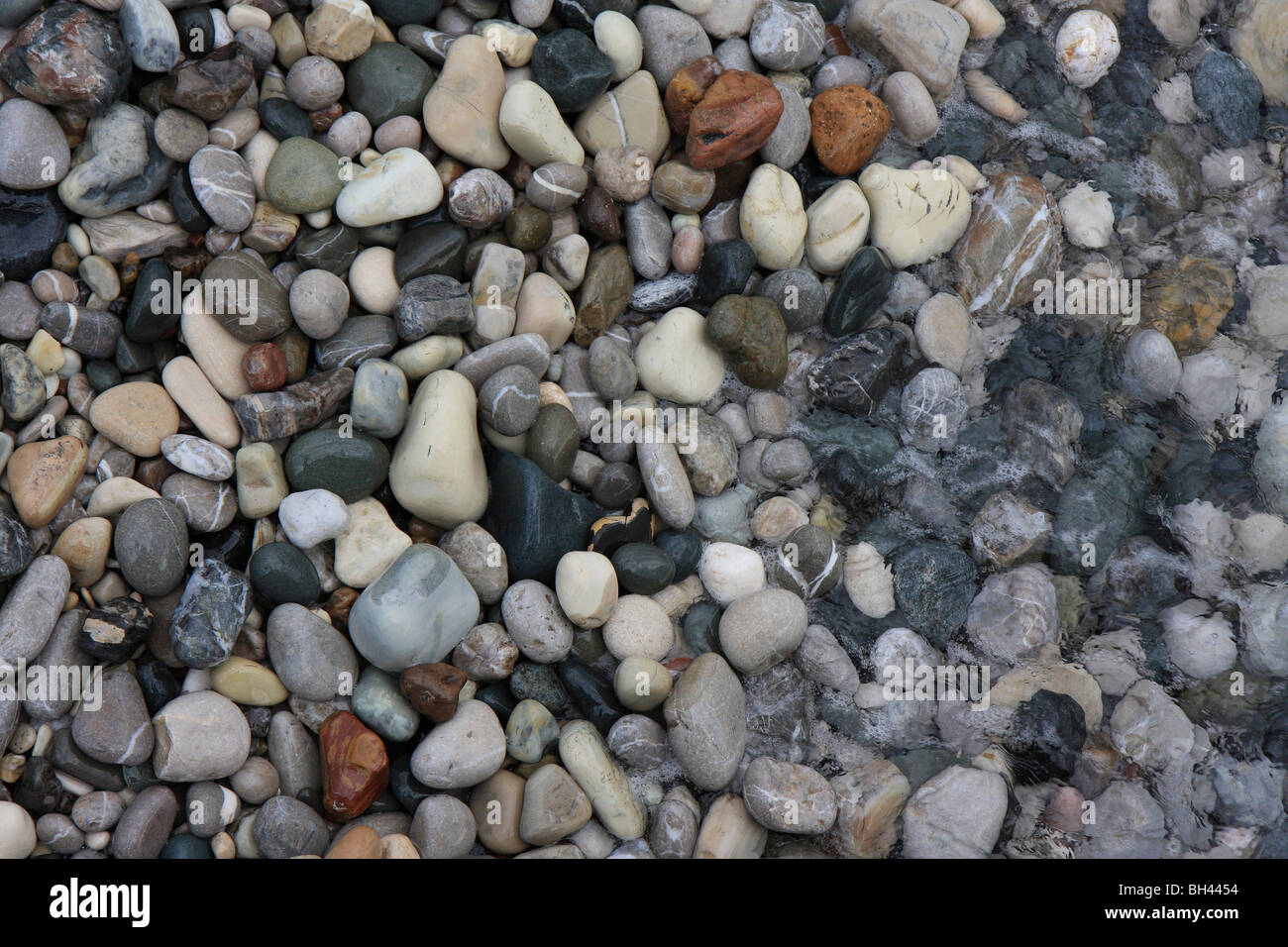 Flint beach at Aphrodite's rock Stock Photo - Alamy