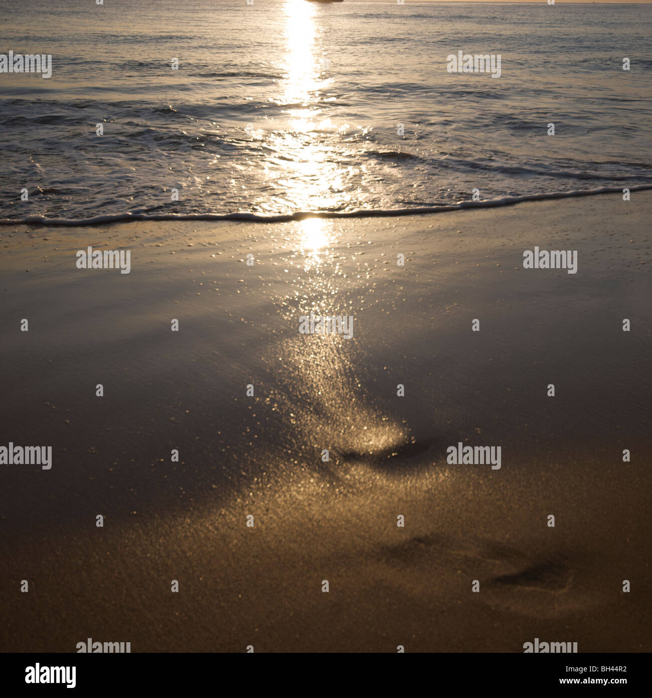 Sea, sun and sand at sunrise Stock Photo - Alamy