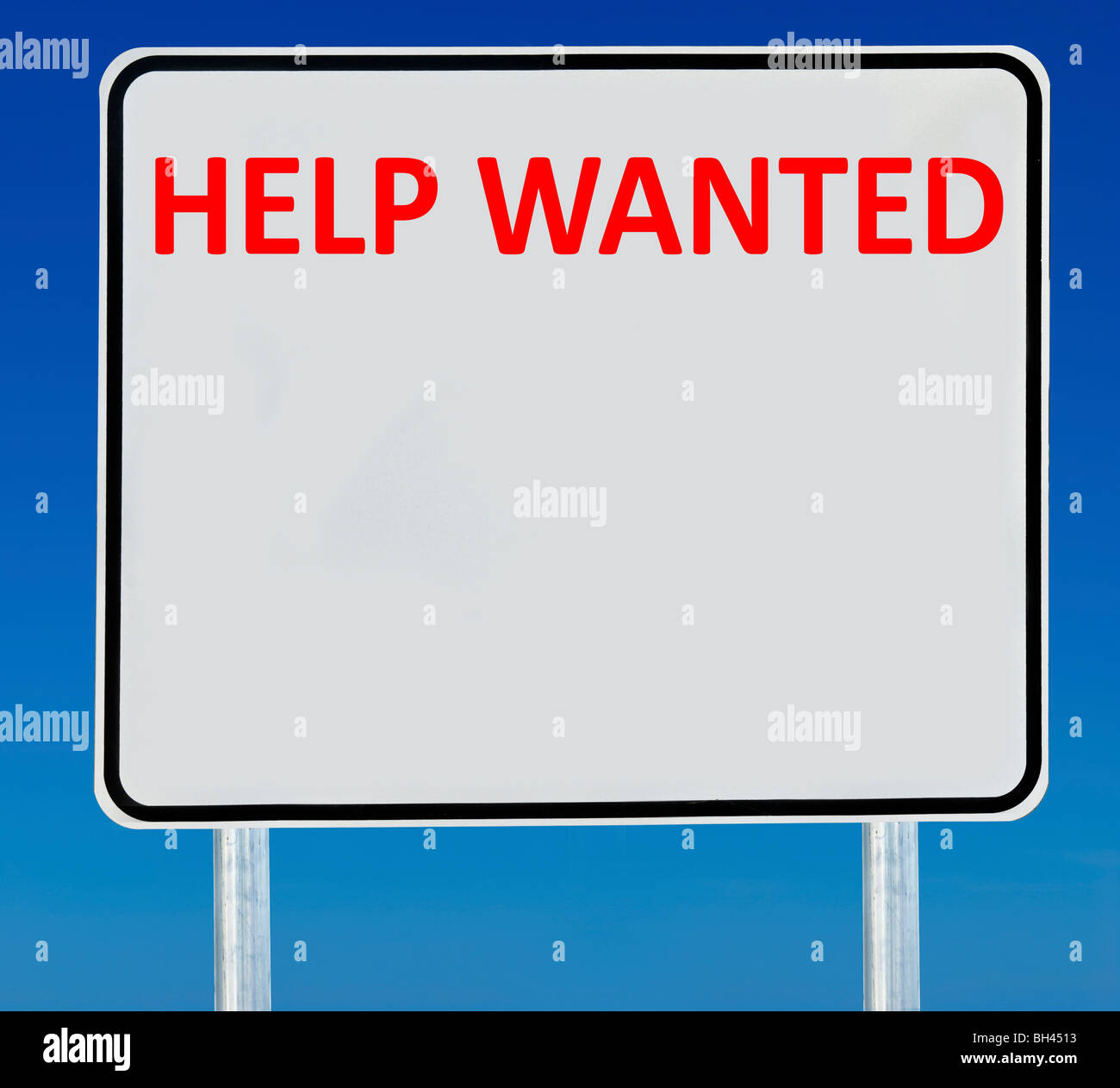 A "Help Wanted" sign isolated on a blue graduated sky Stock Photo - Alamy