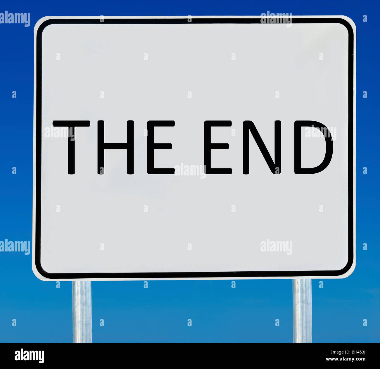 A "The End" sign isolated on a blue graduated sky Stock Photo - Alamy