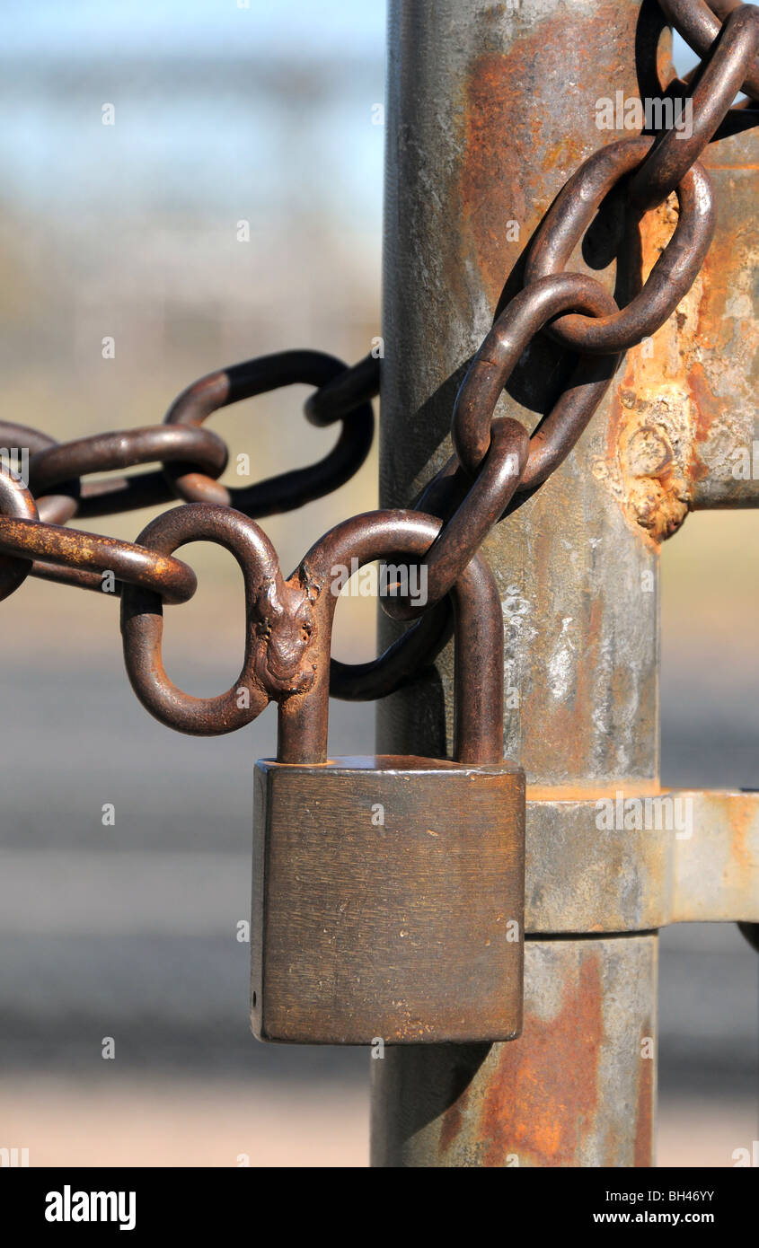A padlock on a gate at a school Stock Photo - Alamy