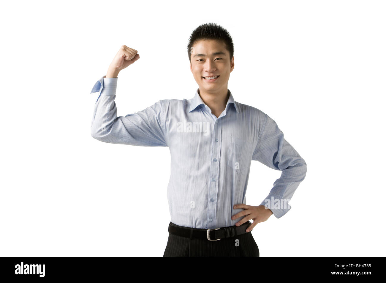 Businessman showing strength Stock Photo - Alamy