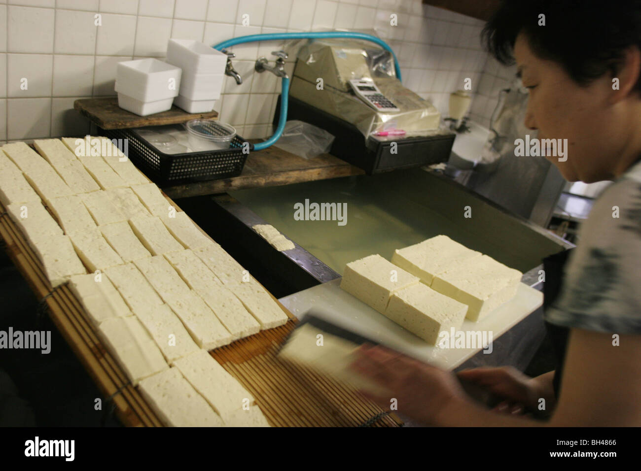 Making tofu in tofu shop, with GE free soya. Tokyo, Japan Stock Photo ...