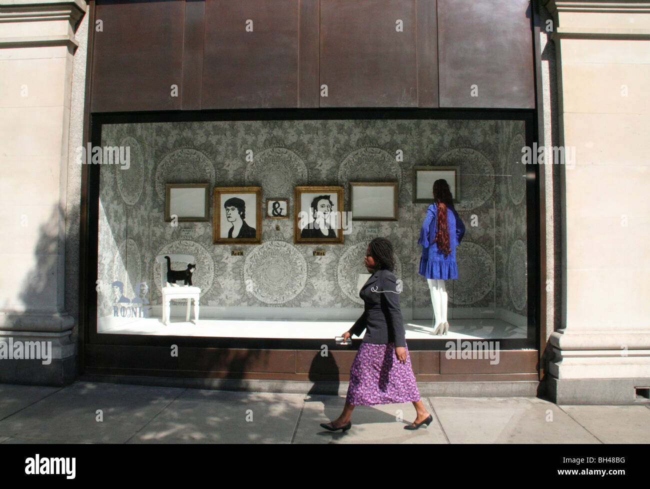 Lady passing a shopping window in Oxford Street Stock Photo - Alamy