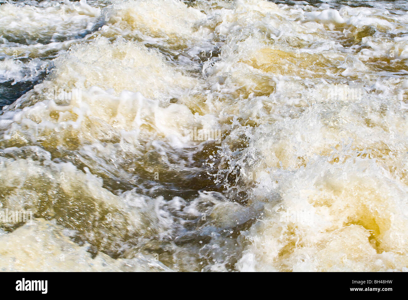 Rushing waters of the weir at Paper Mill Lock near Little Baddow Stock ...