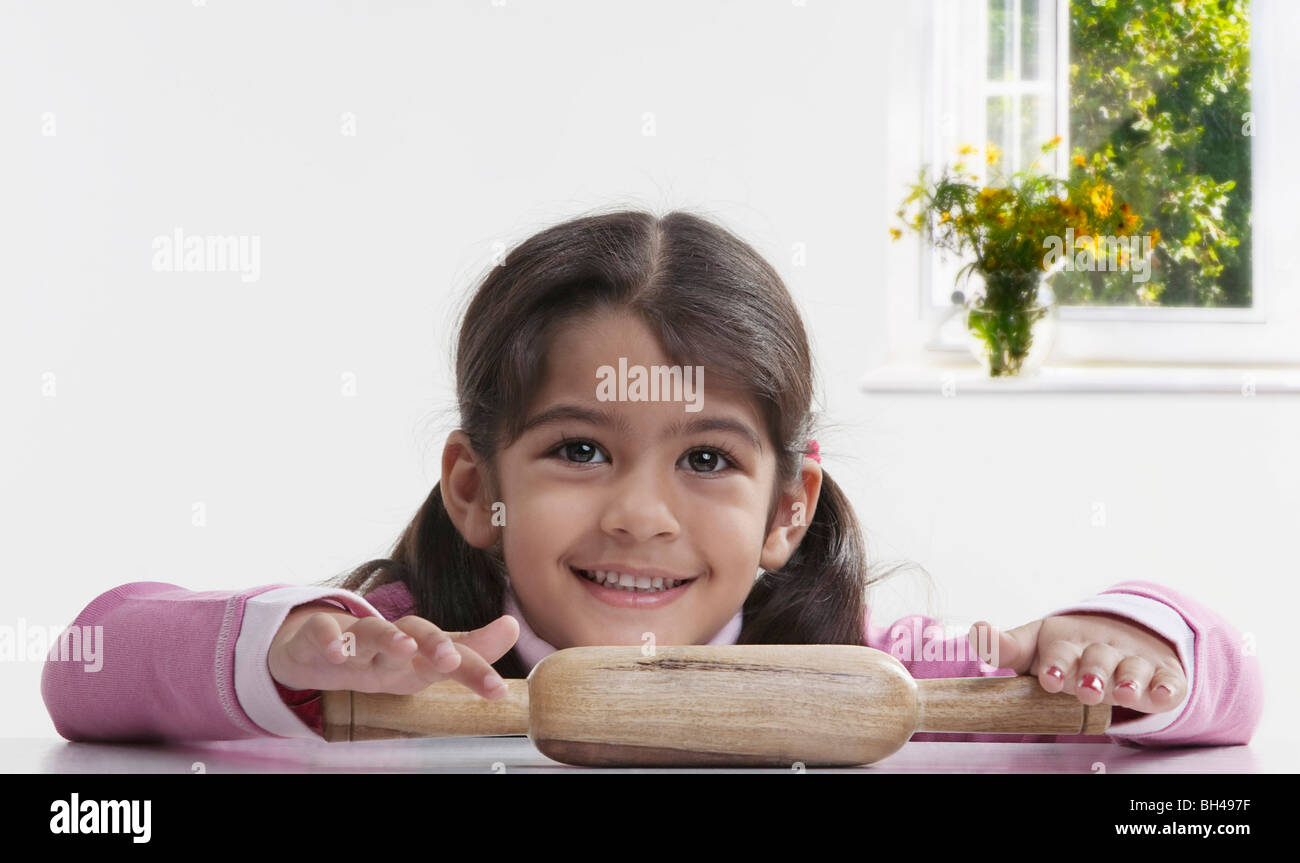 Girl with a rolling pin Stock Photo - Alamy