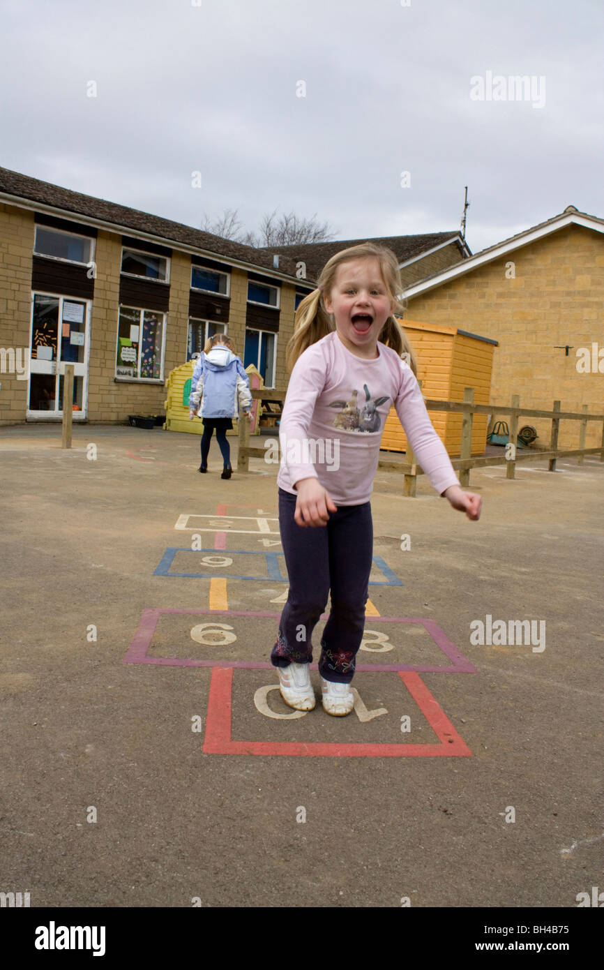 Girl playing traditional hopscotch game hi-res stock photography and ...