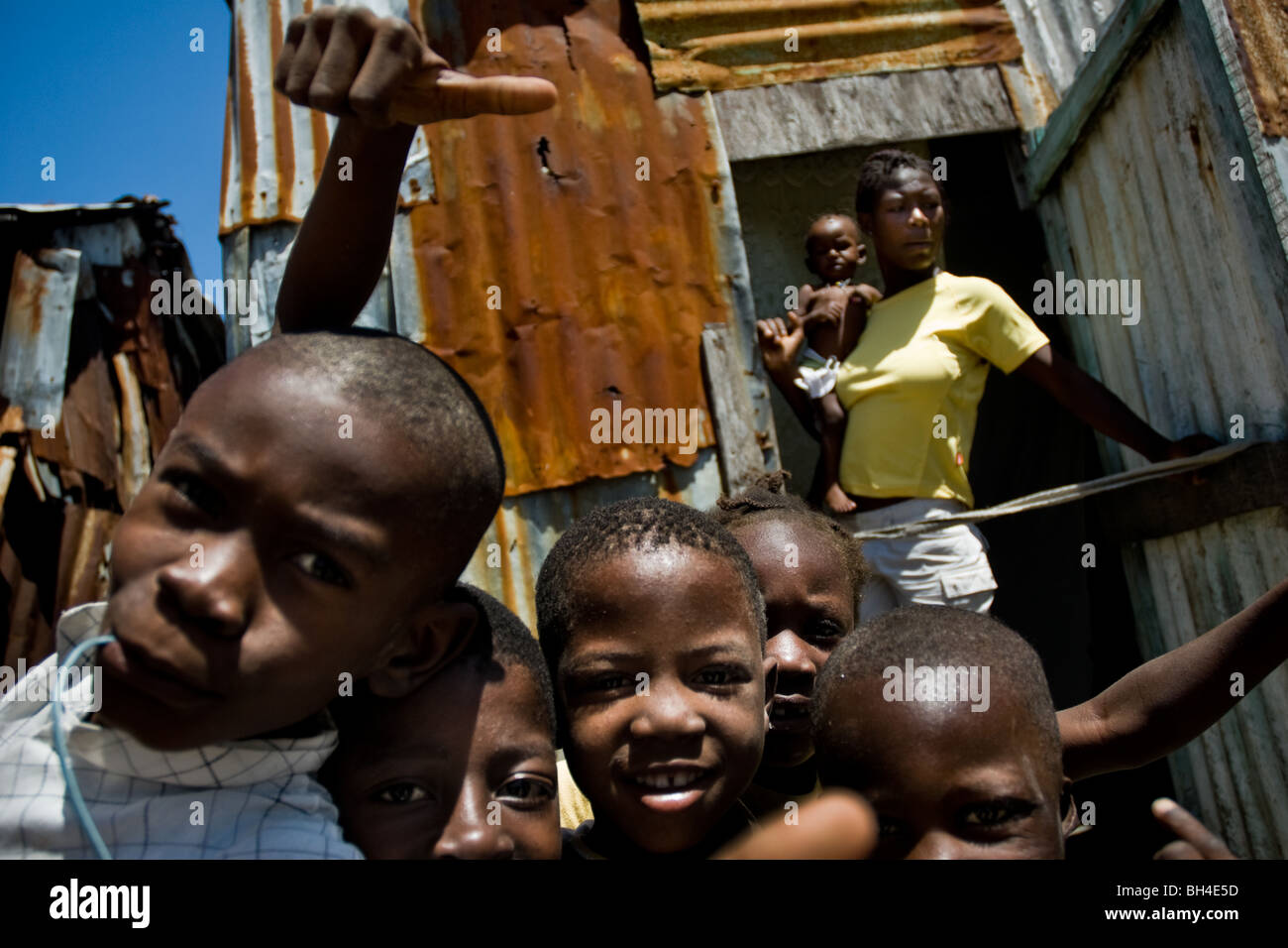 Haitian children playing joyfully in the slum of Cité Soleil Stock ...
