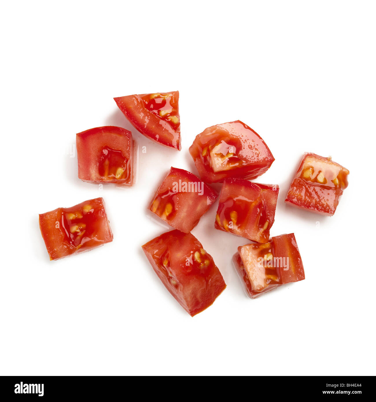 Cubes of tomato on a white background Stock Photo - Alamy
