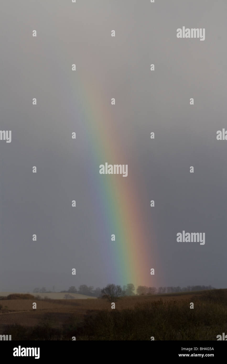 Rainbow in stormy weather Stock Photo - Alamy