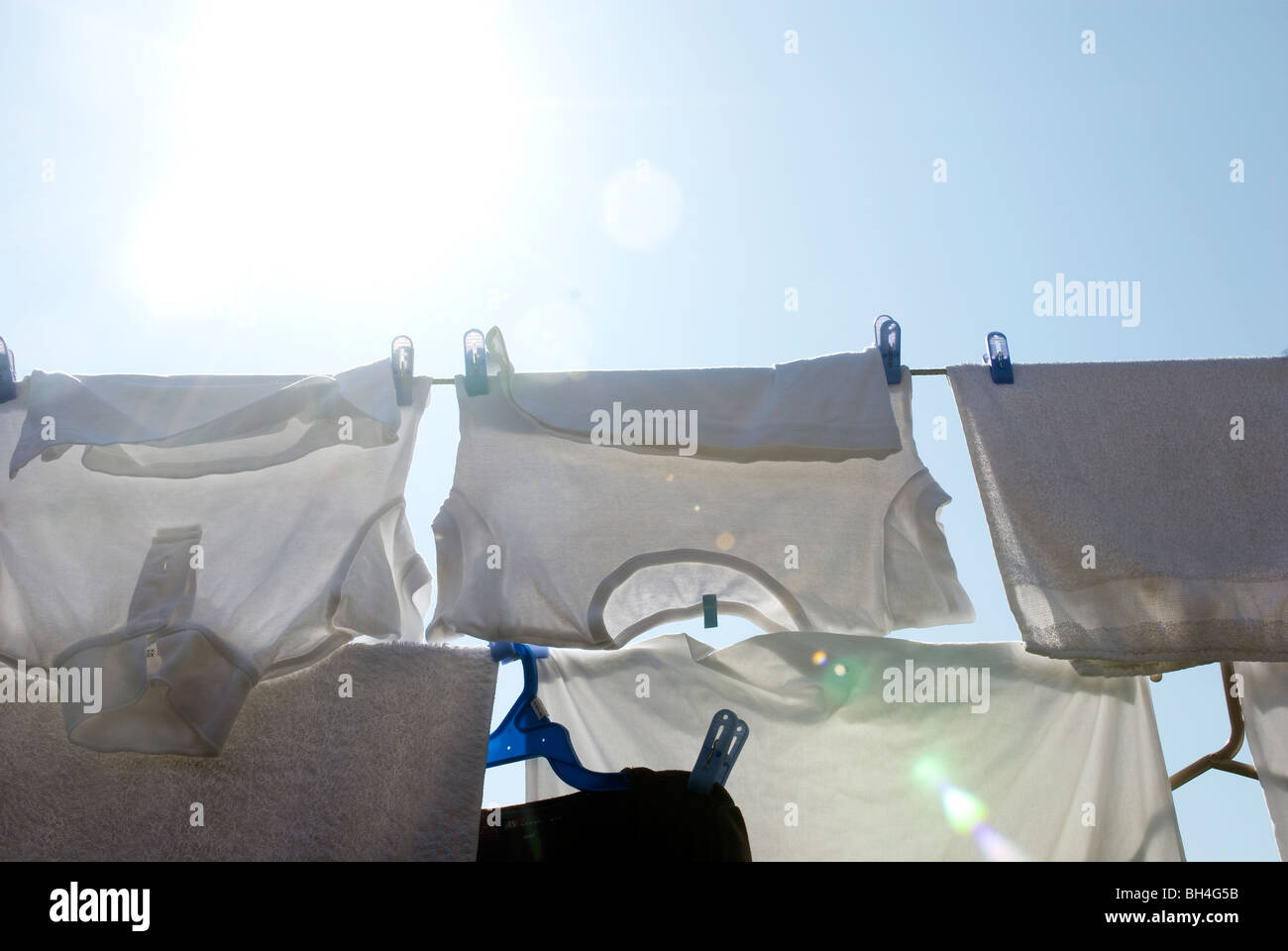 Laundry hanging on clothes line Stock Photo - Alamy