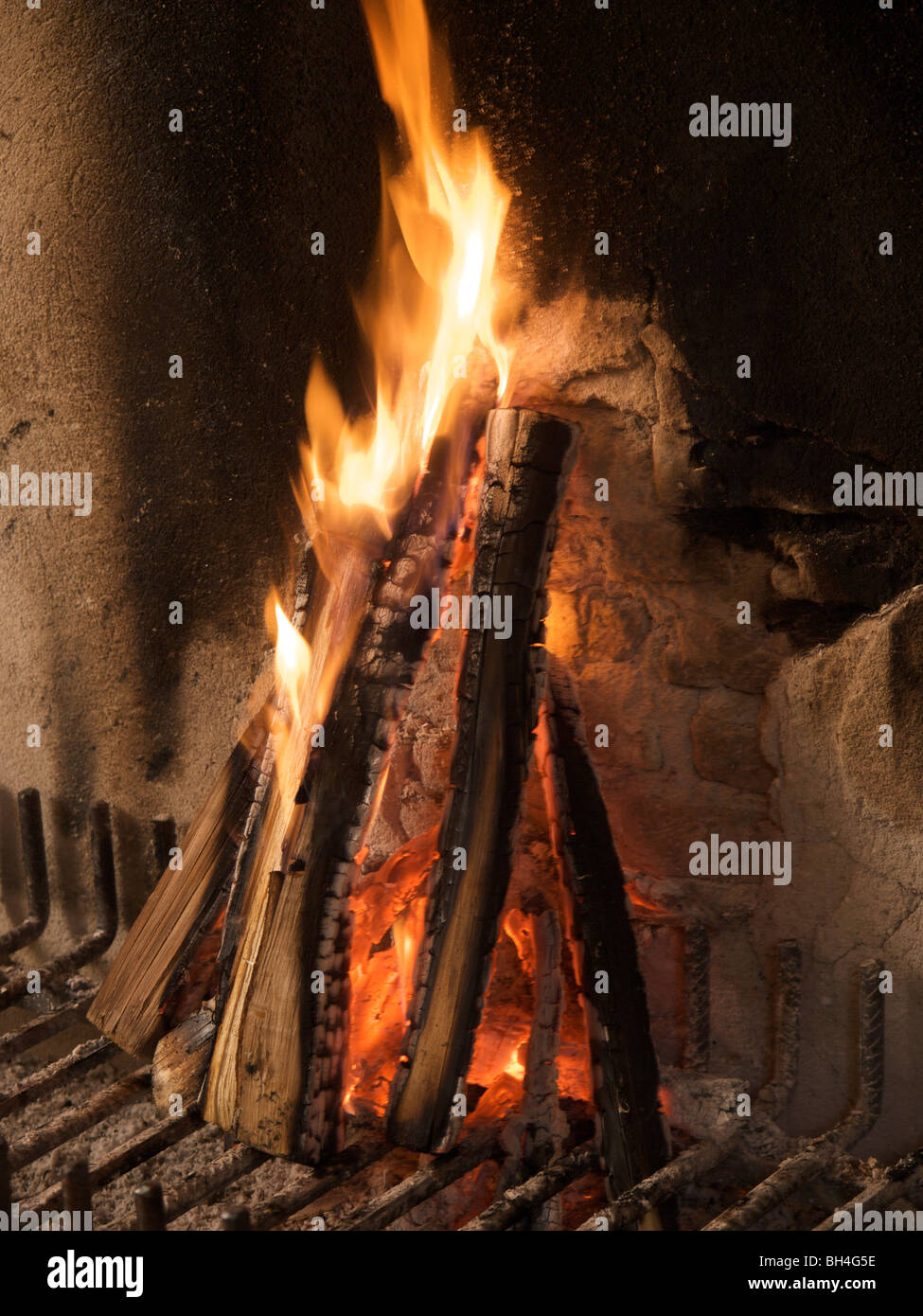 Close up of wood fire burning in 17th century fireplace Stock Photo - Alamy