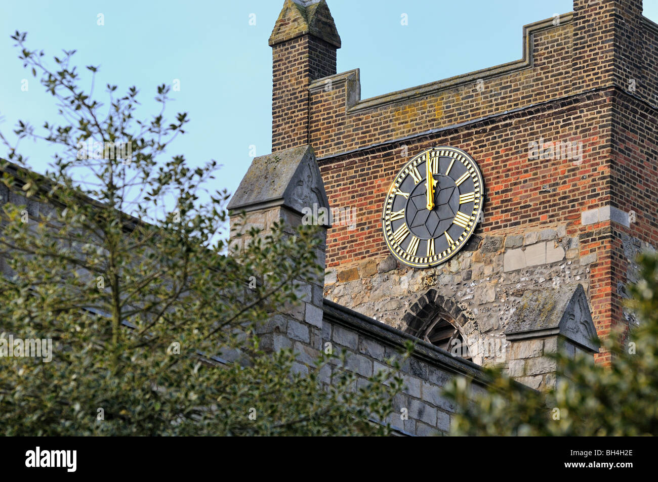Church clock at mid-day Stock Photo - Alamy