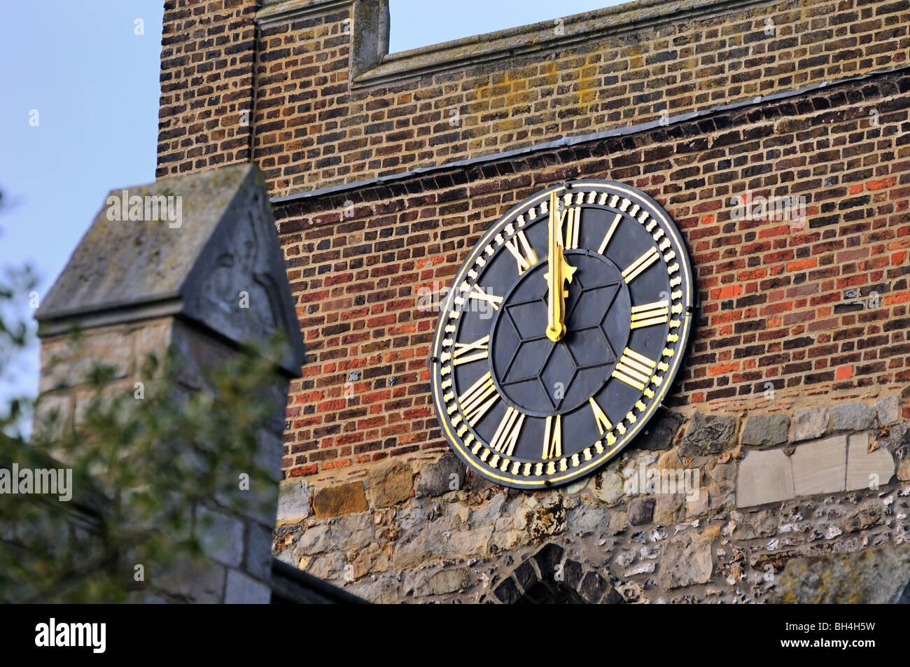 Church clock at mid-day Stock Photo - Alamy