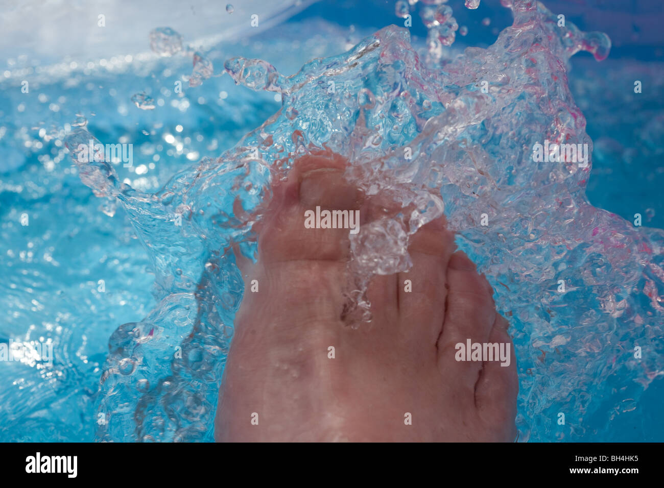 Water splash toes paddling pool summer fun Stock Photo - Alamy