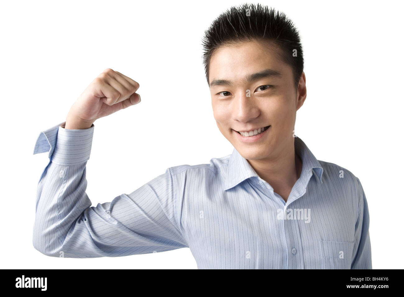 Businessman showing strength Stock Photo - Alamy