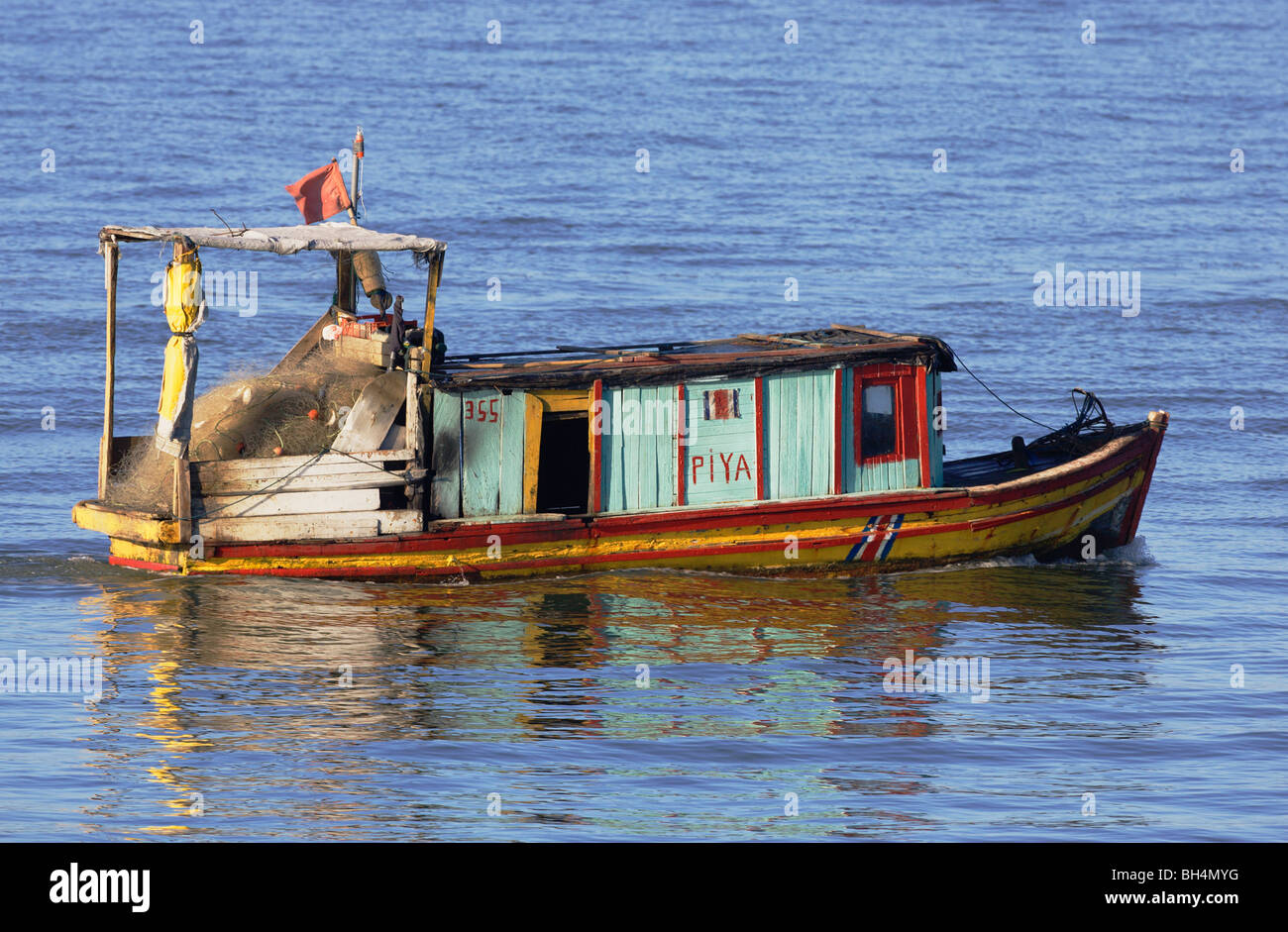Brightly coloured fishing boat Stock Photo - Alamy