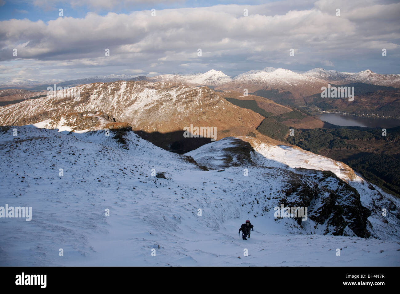 Climbers ascending a snow gully on Beinn Bheula in the Arrochar Alps ...