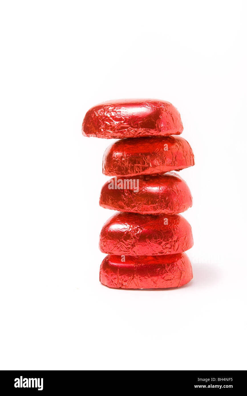 Red foil wrapped chocolate hearts for valentine's day Stock Photo - Alamy
