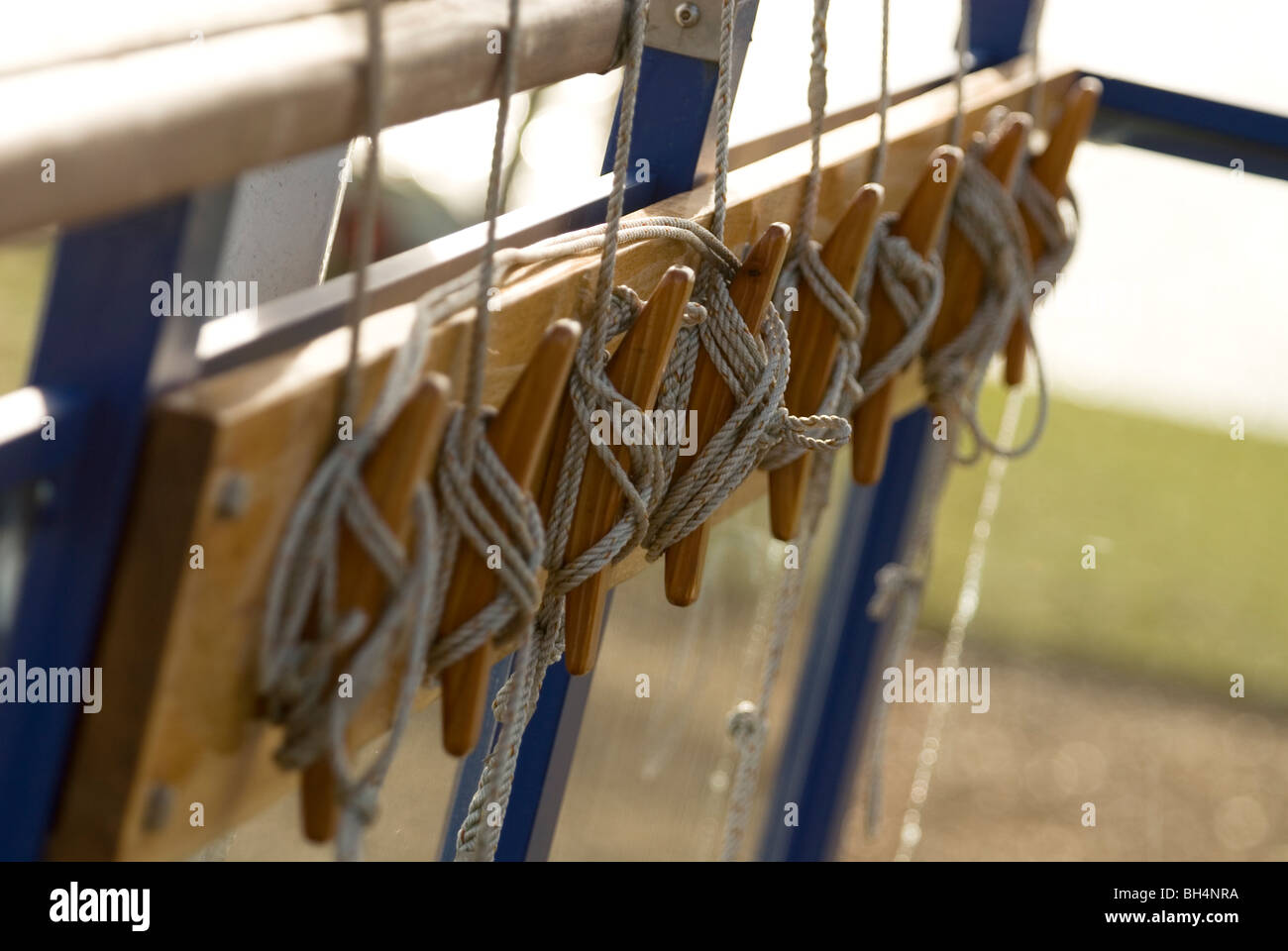 A row of wooden cleats ready to hoist flags Stock Photo - Alamy