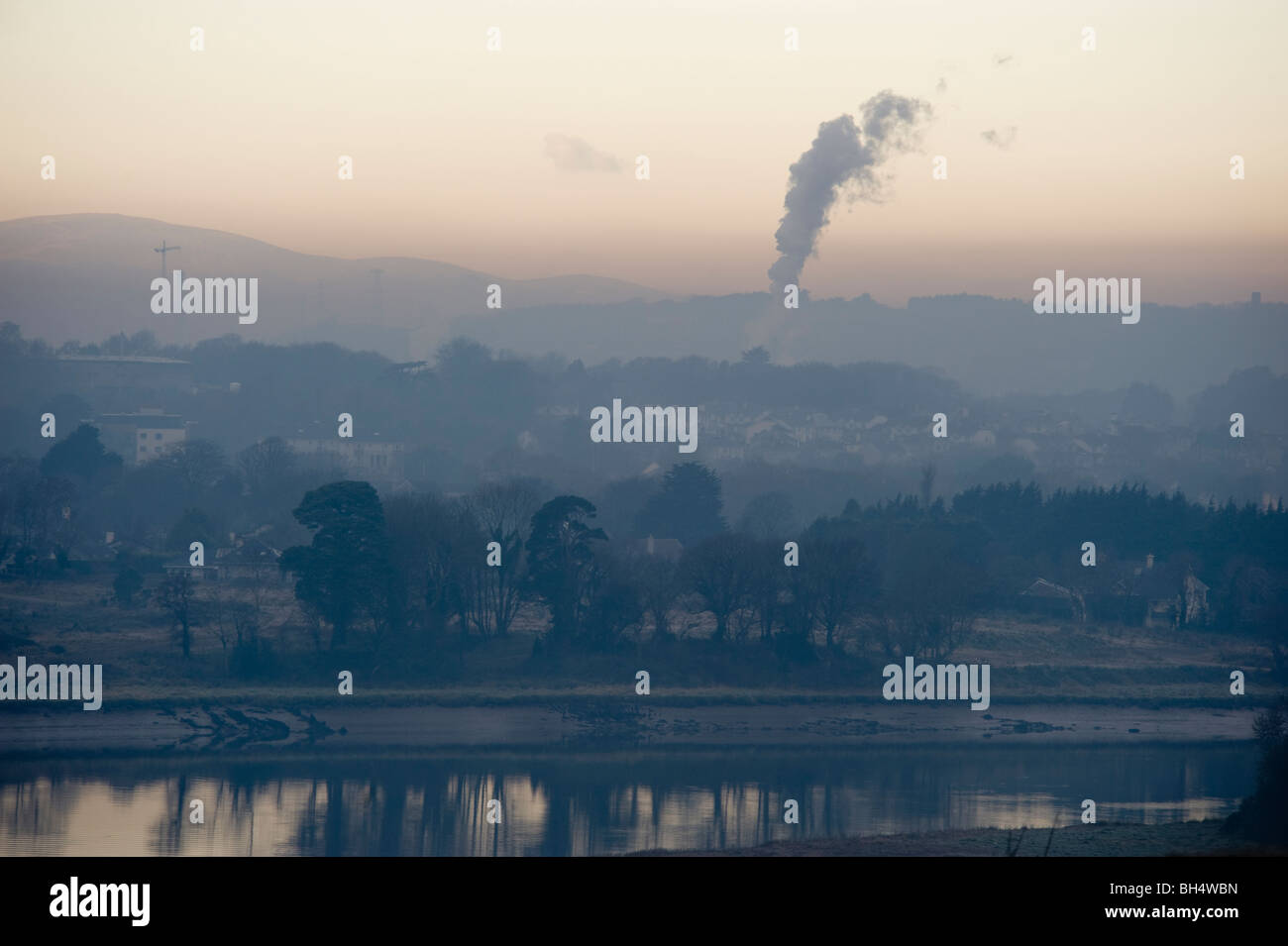 smoke rising from a factory plant Stock Photo - Alamy