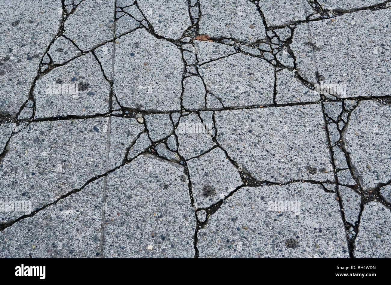 Cracks in concrete pavement Stock Photo - Alamy