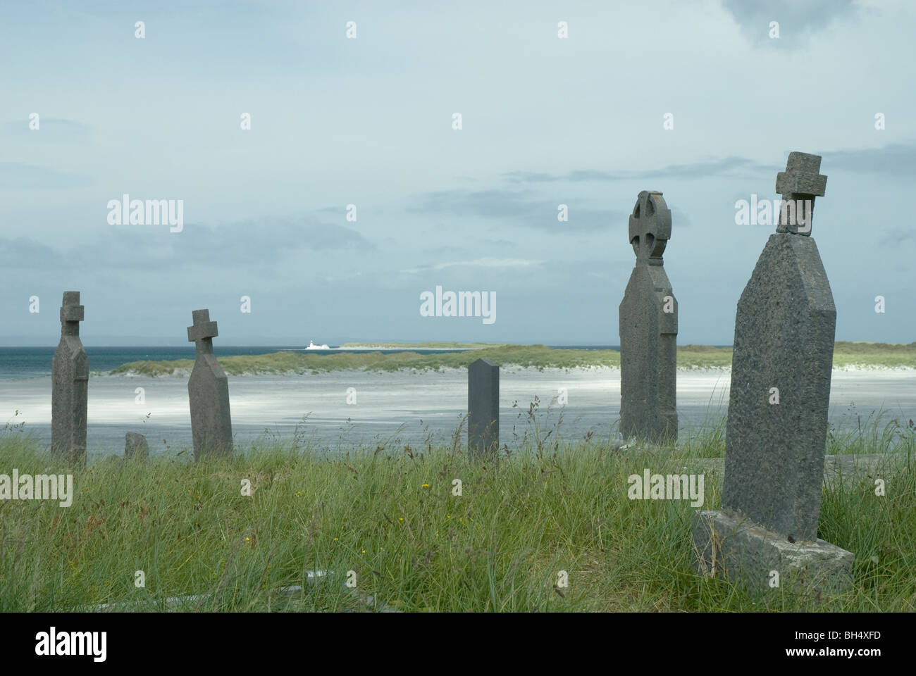 Headstones overlooking the beach, sea and a lighthouse, Inis Mor, Aran ...