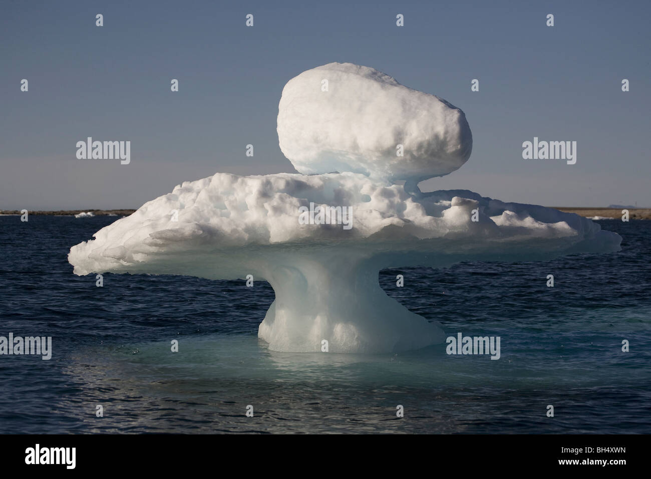 Sculptured iceberg off the coast created by natural weather conditions ...