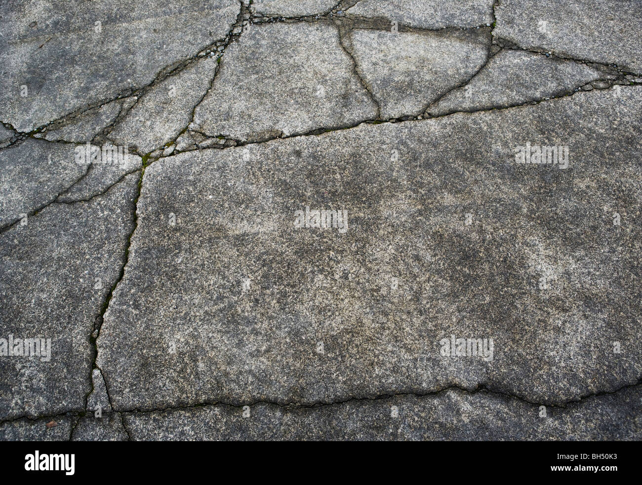 Cracks in concrete pavement Stock Photo - Alamy
