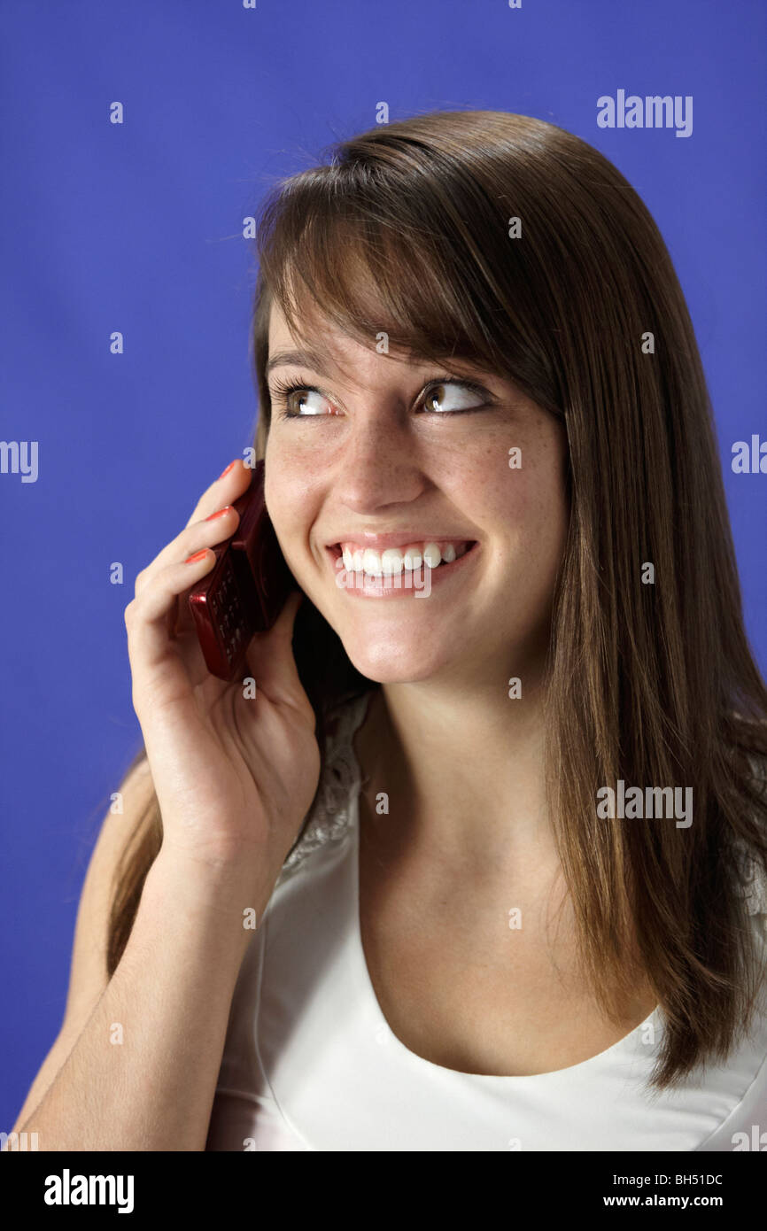 A young girl alone smiling and happy Stock Photo - Alamy