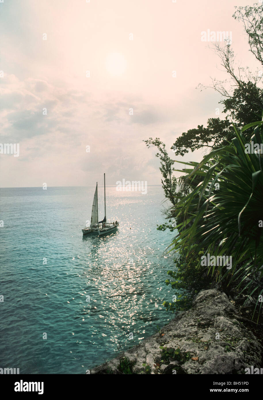 Catamaran sailboat anchored at West End cliffs, Negrill, Jamaica, WI ...