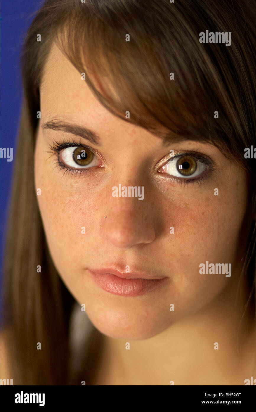 A young girl alone smiling and happy Stock Photo - Alamy
